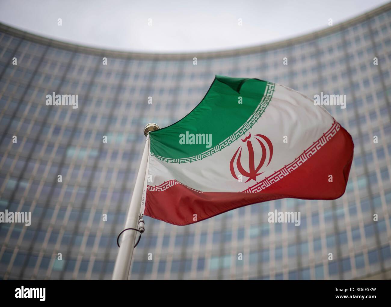 FILE -A national flag of Iran waves in front of the building of the ...
