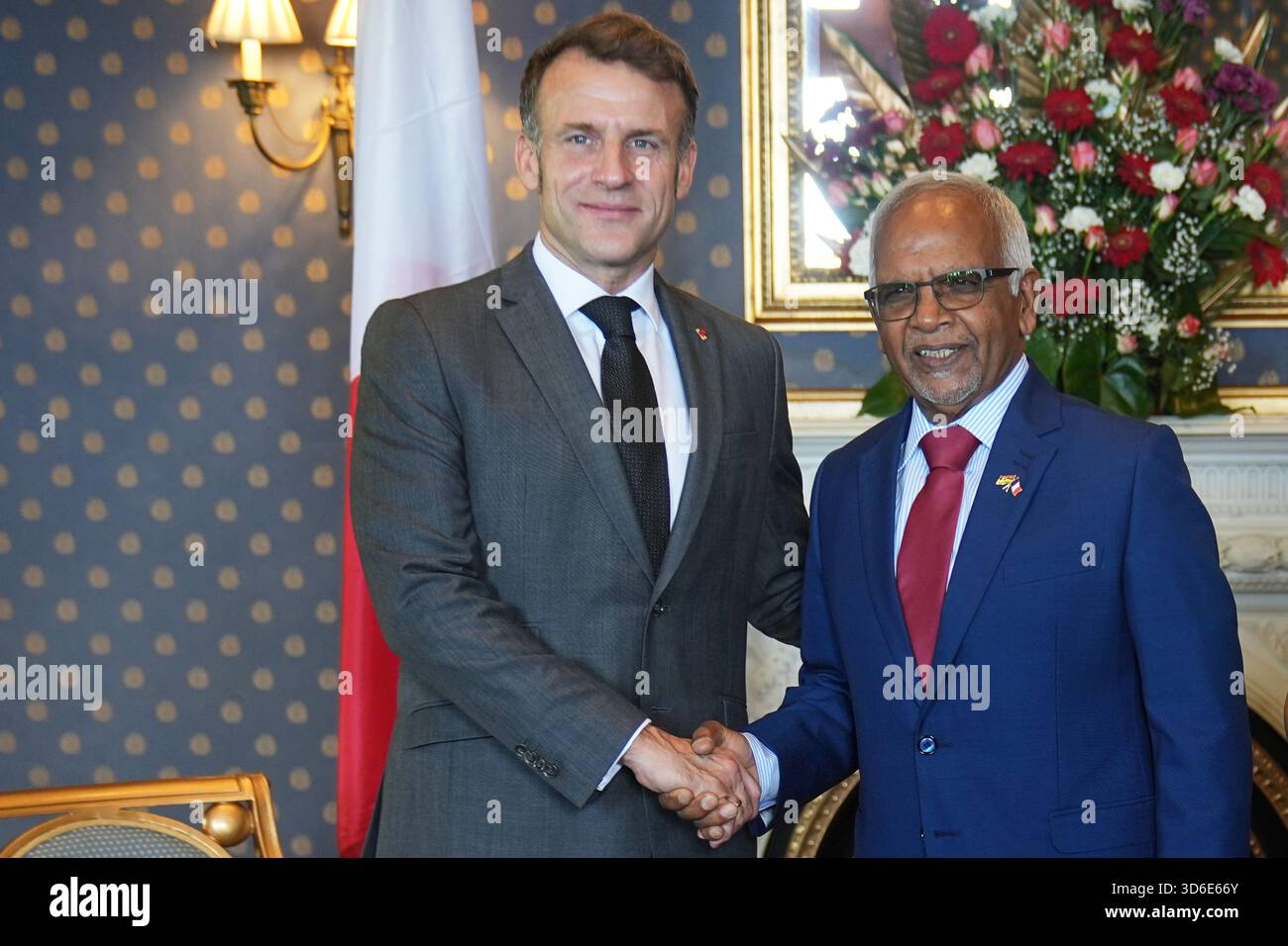 French President Emmanuel Macron, left, shakes hands to Mauritius ...