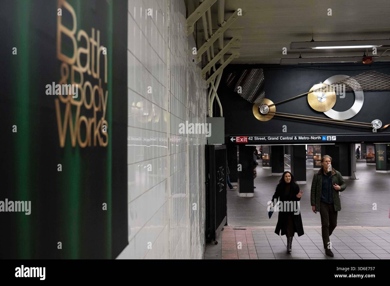 People walk past the posters promoting the campaign by Bath & Body ...