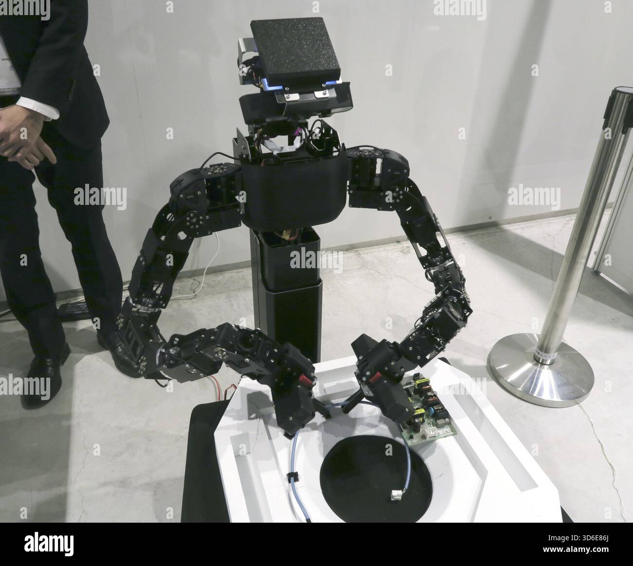 An AI robot developed by Hitachi Ltd. engages in electrical wiring work ...