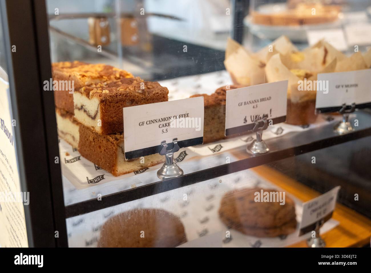 Bakery display case with gluten-free cinnamon coffee cake and banana ...
