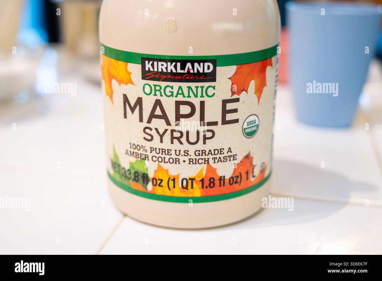 Close-up of container of Costco Kirkland Signature brand maple syrup ...