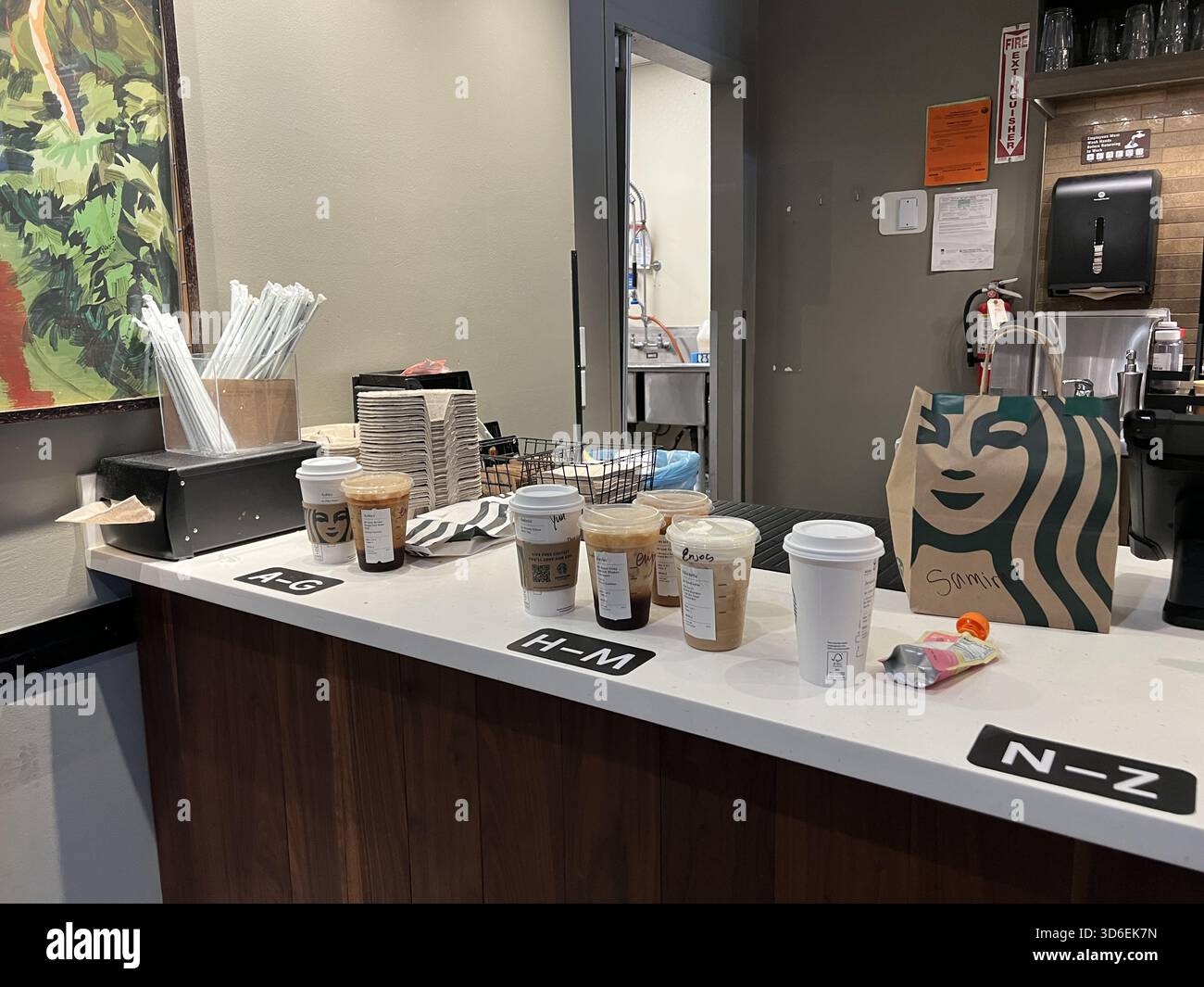 Drink pickup counter with a variety of mobile orders and other orders ...