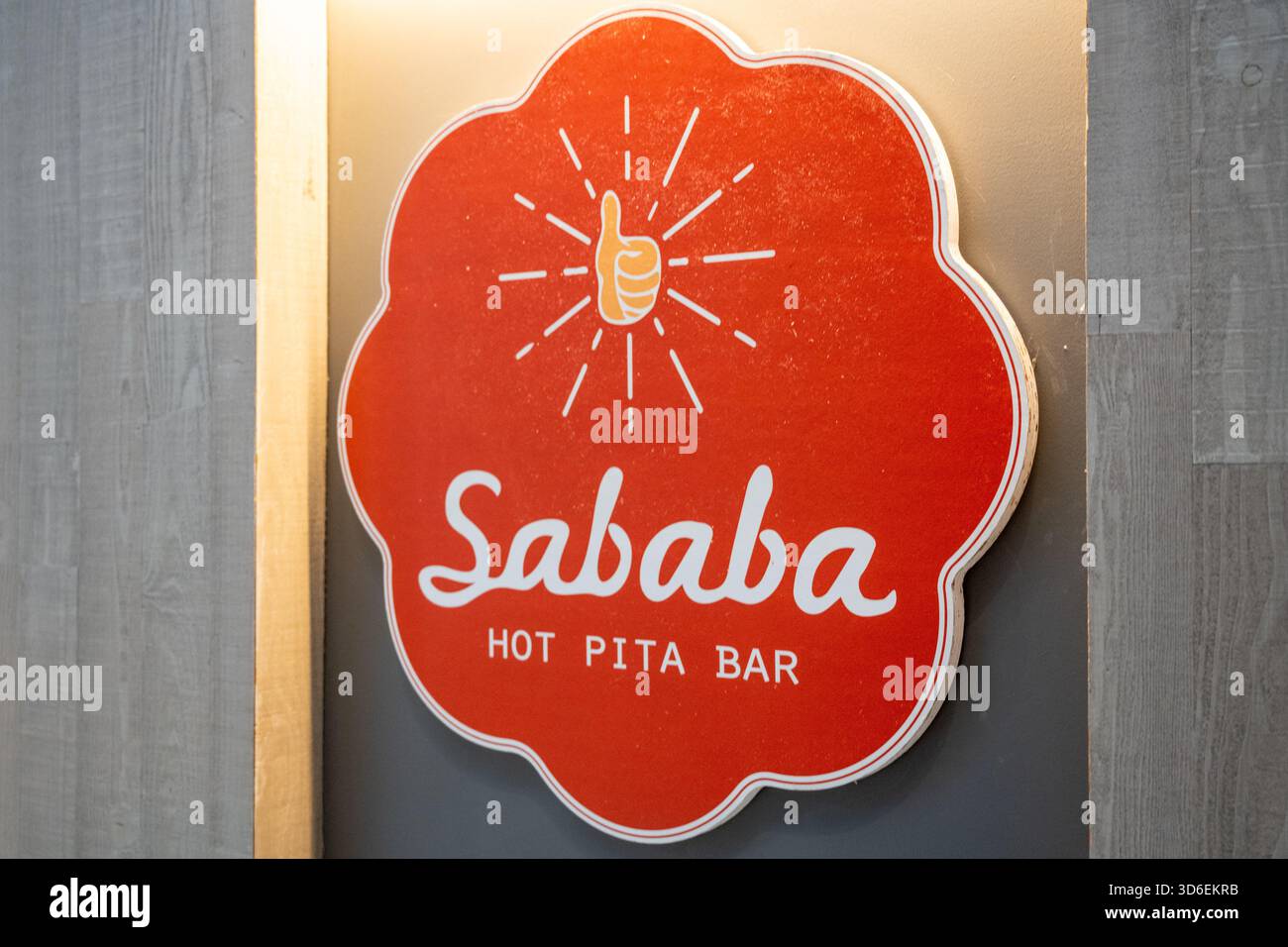 Close-up of Sababa Hot Pita Bar interior sign with thumbs-up logo on ...