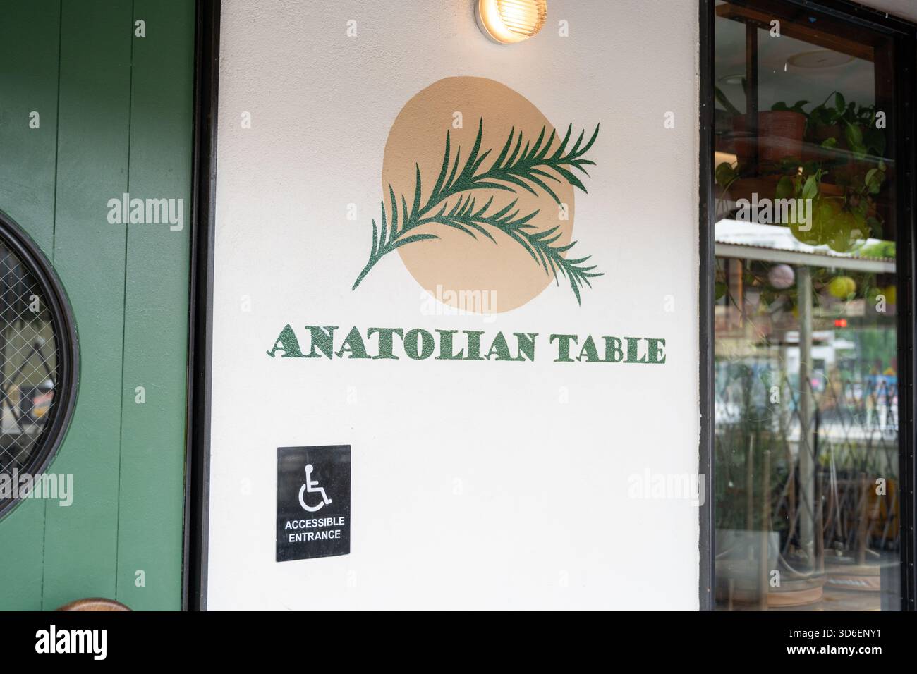 Close-up of Anatolian Table logo painted on exterior wall next to ...