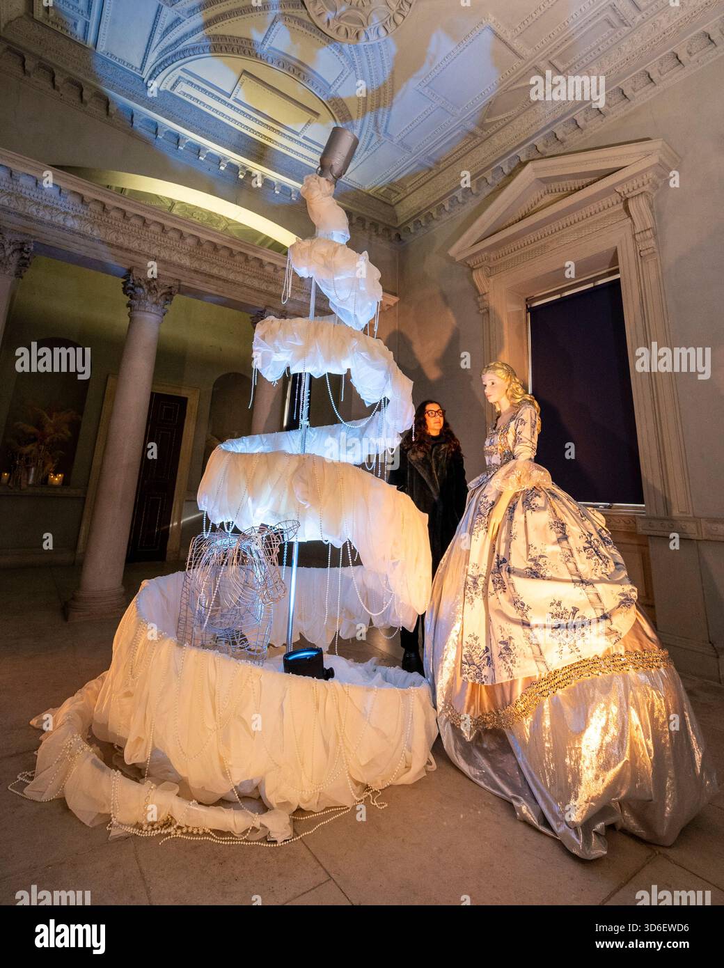 London, UK. 20 November 2025. A staff member with (some of) eight maids ...