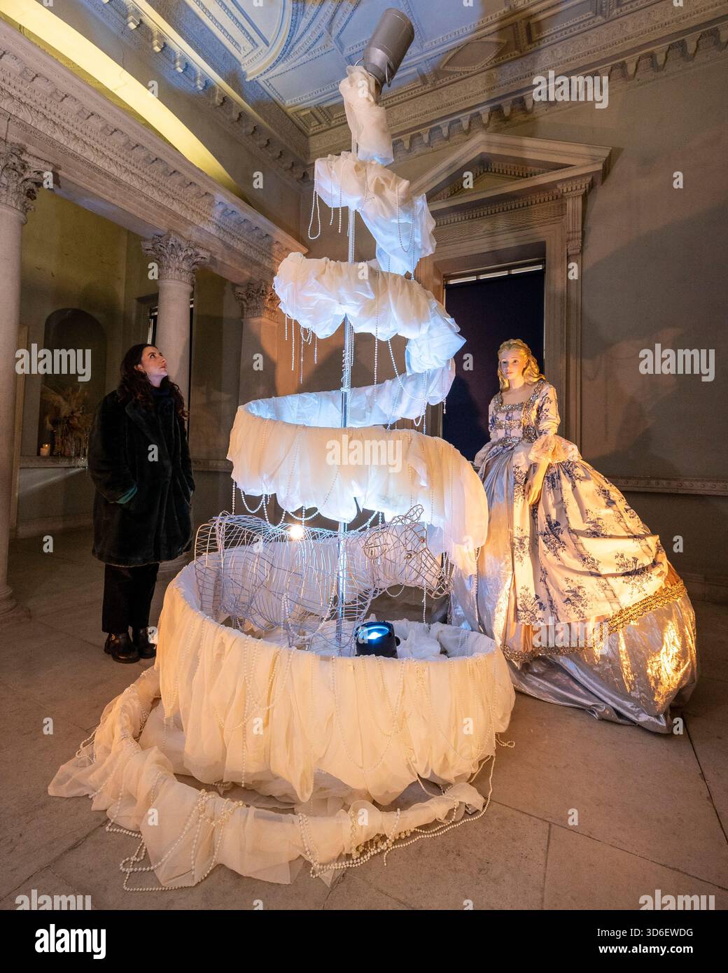 London, UK. 20 November 2025. A staff member with (some of) eight maids ...