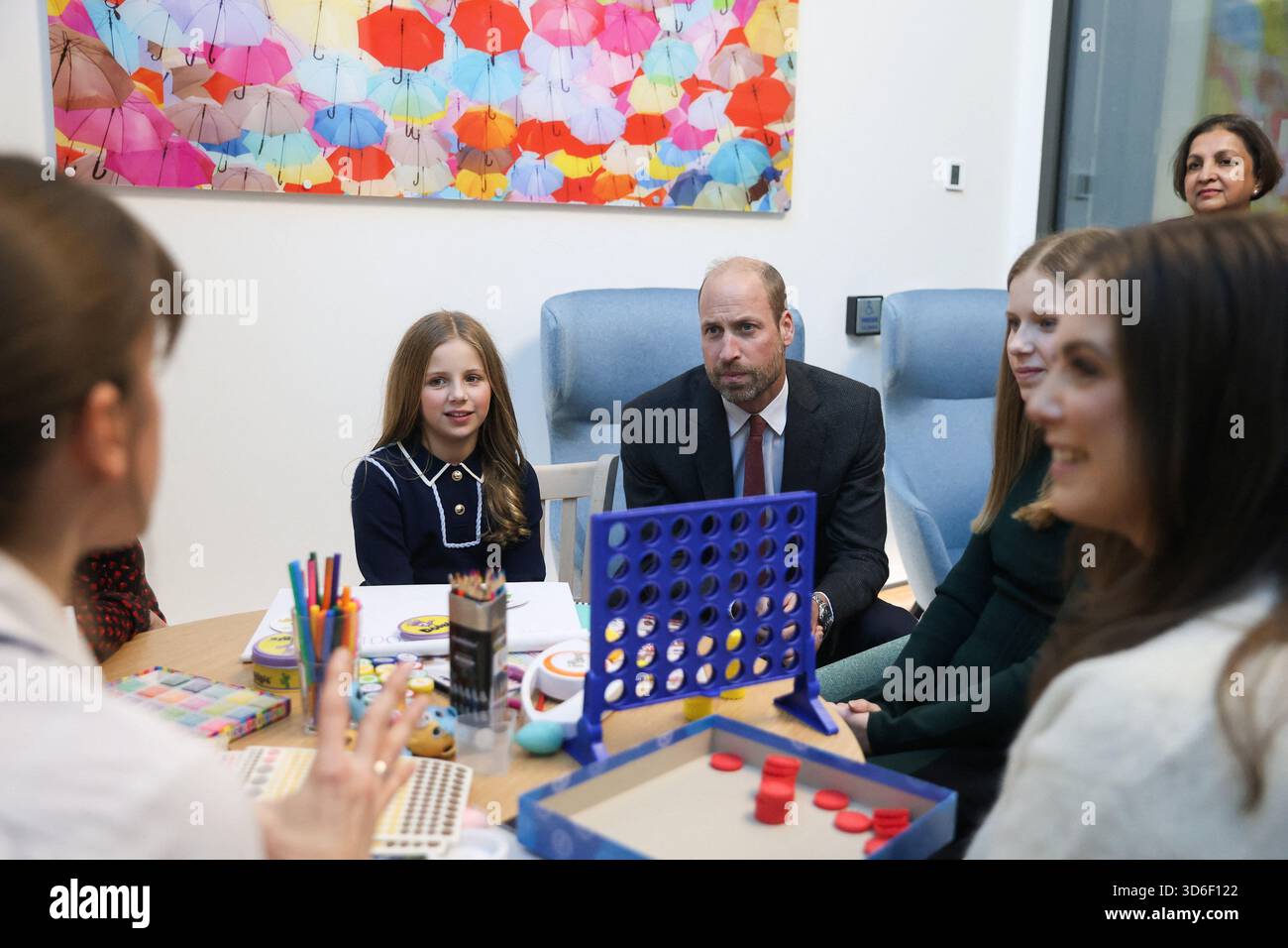 The Prince of Wales sits with Macy and Maya, the daughters of the late ...