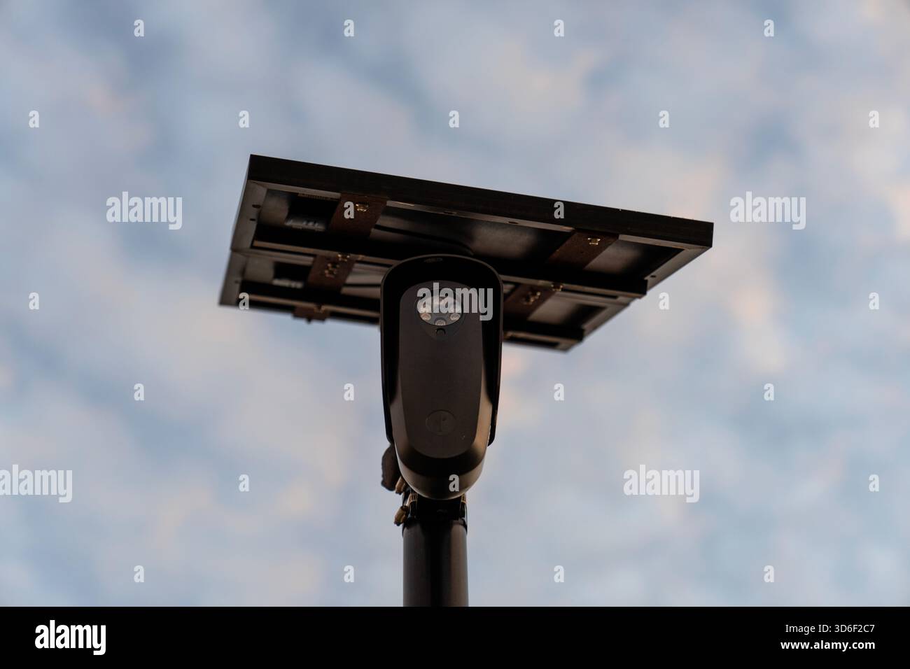 A Flock Safety license plate reader is seen along a public road ...