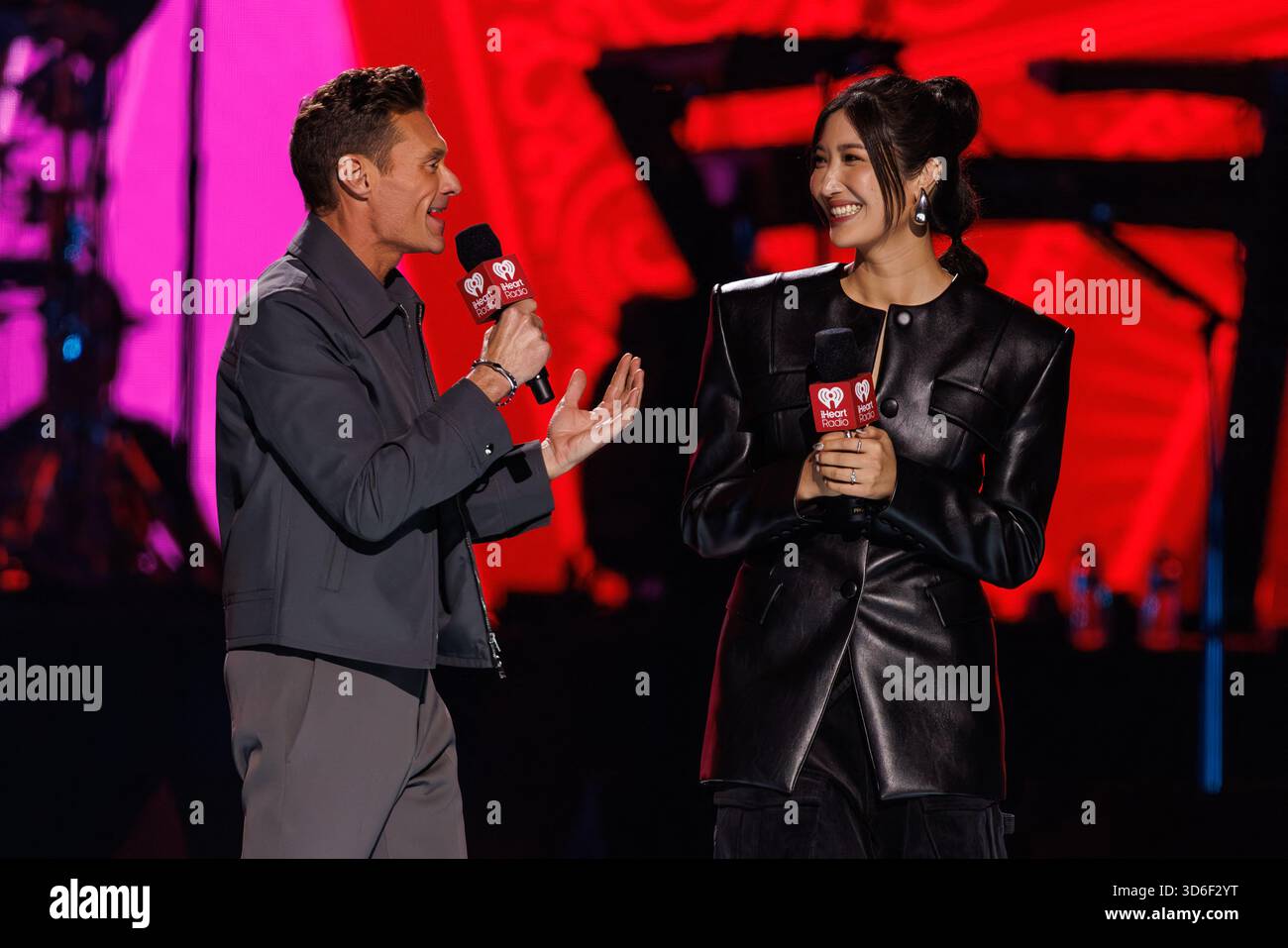 Host Ryan Seacrest and EJAE speak on stage during the iHeartRadio Music ...