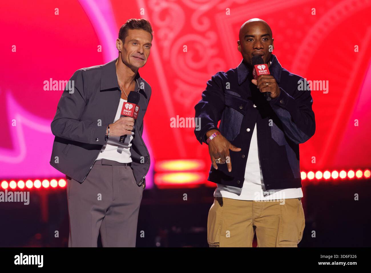 Host Ryan Seacrest and Charlamagne tha God speak on stage during the ...
