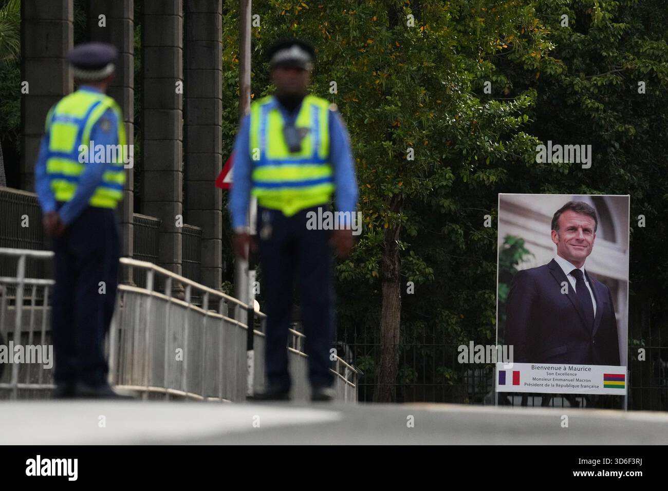 Police officers guard the government house where French President ...