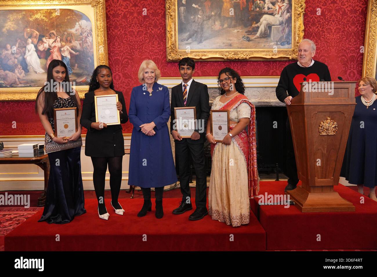 Queen Camilla (centre) stands with (left to right) Senior Winner, Kaira ...