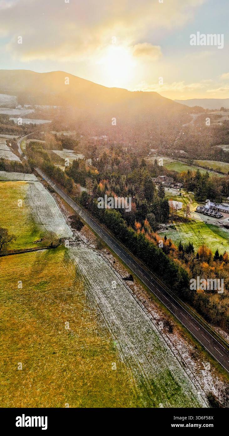 Vertical drone photo showing the A9 road surrounded by a winter ...