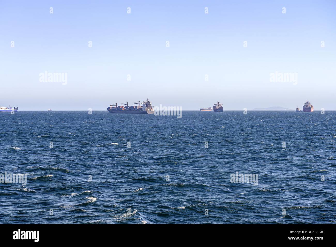 Oil tanker crossing the Strait of Gibraltar with other ships on the ...