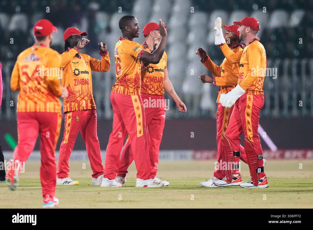 Zimbabwe's Tinotenda Maposa, center, celebrates with teammates after ...