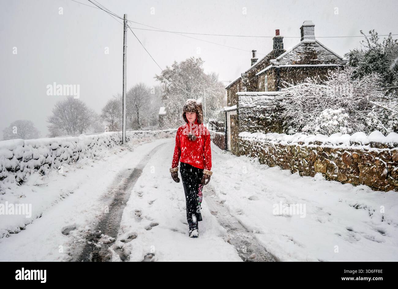PARENTAL PERMISSION GIVEN A girl walking in the snow in Whitby. Snow ...