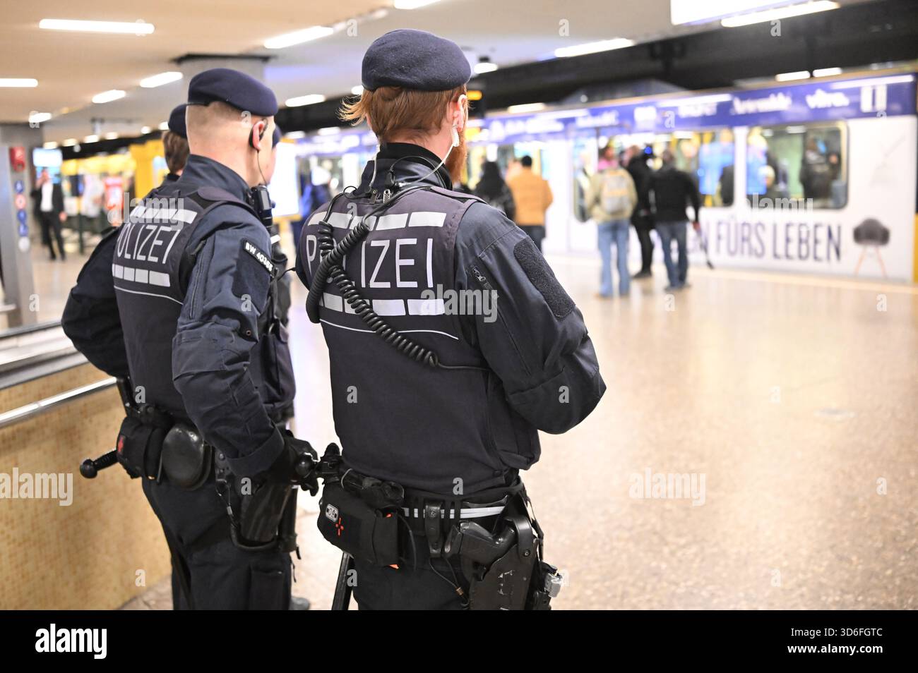 20 November 2025, Baden-Württemberg, Stuttgart: Police officers at the ...
