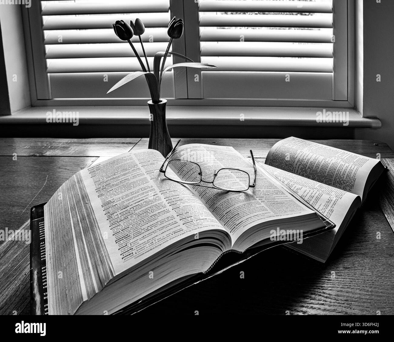 Open books table Black and White Stock Photos & Images - Alamy
