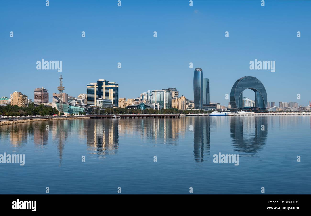 Panoramic daytime view of Baku with modern skyscrapers, featuring the ...