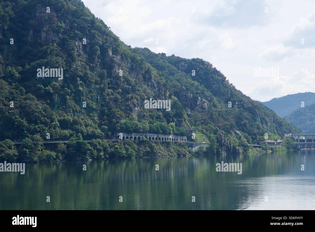 Arched gallery tunnels trace the foot of Samaksan above Uiam Lake ...