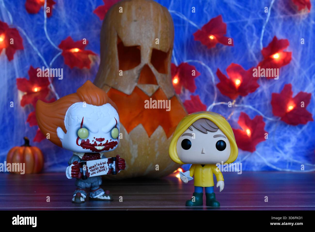 Funko Pop action figures of Pennywise clown and Georgie from horror ...