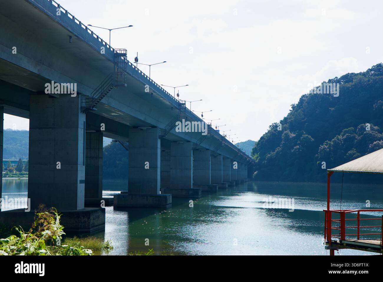 Concrete piers and maintenance stairs of Kyunggang Bridge stand over ...