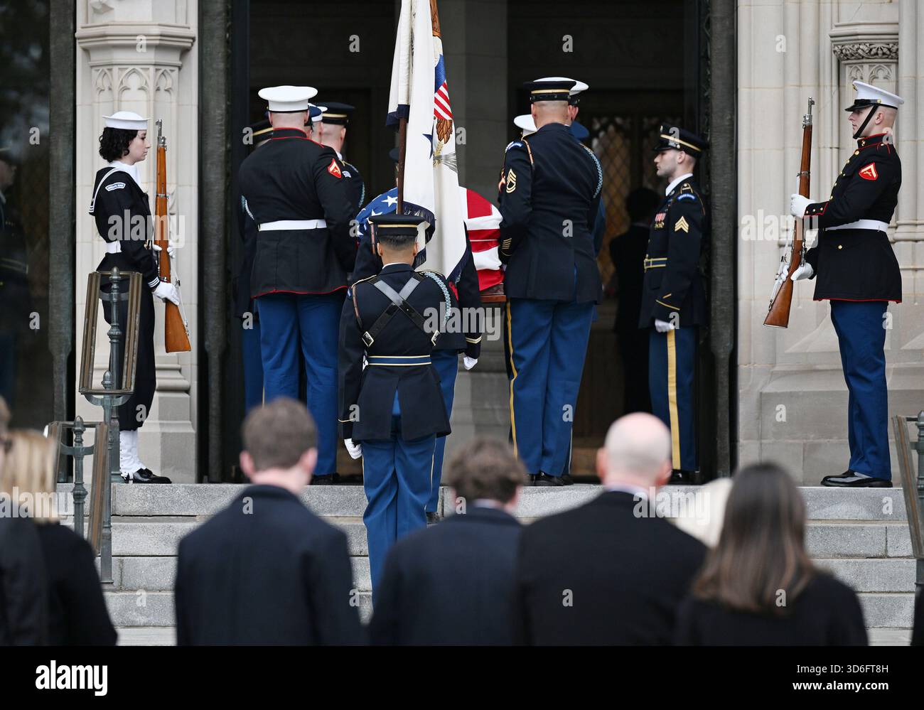 A military guard carries the casket of former Vice President Dick ...