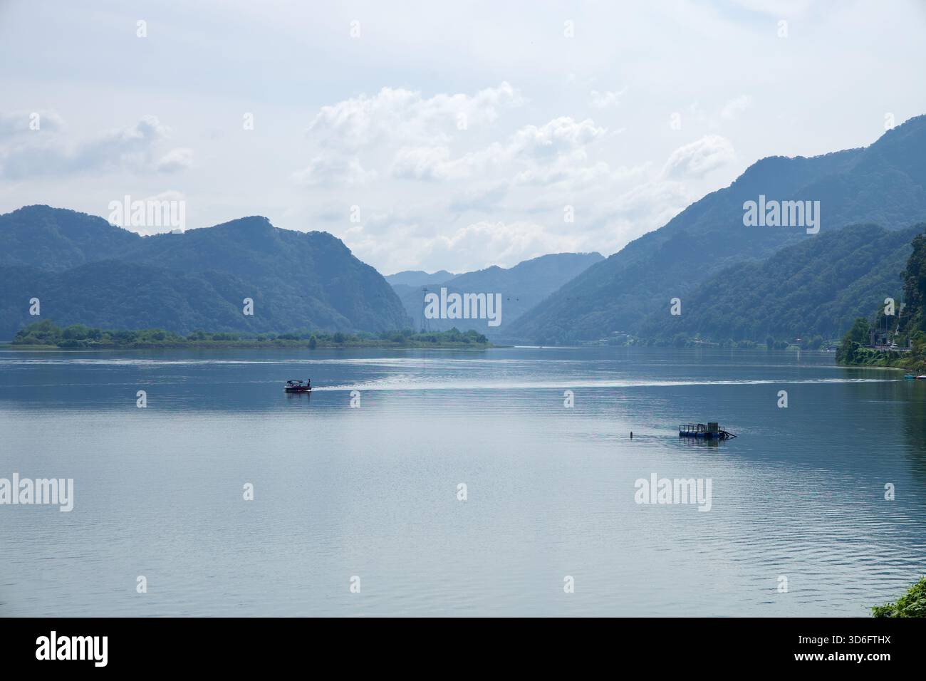 Small boats motor across hi-res stock photography and images - Alamy