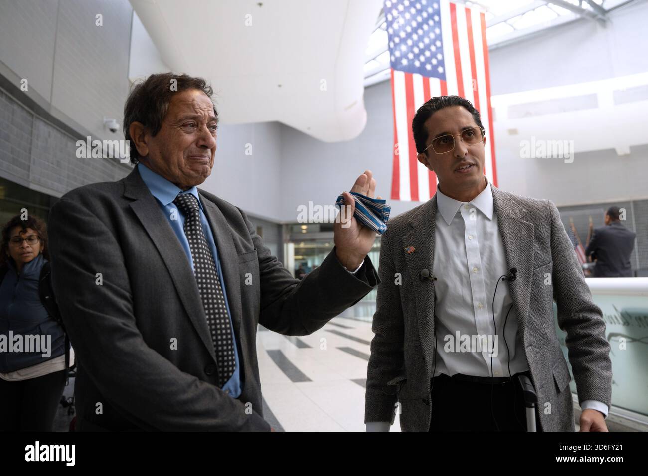 Father-son duo Saad and Ibrahim Almadi speak to reporters after ...