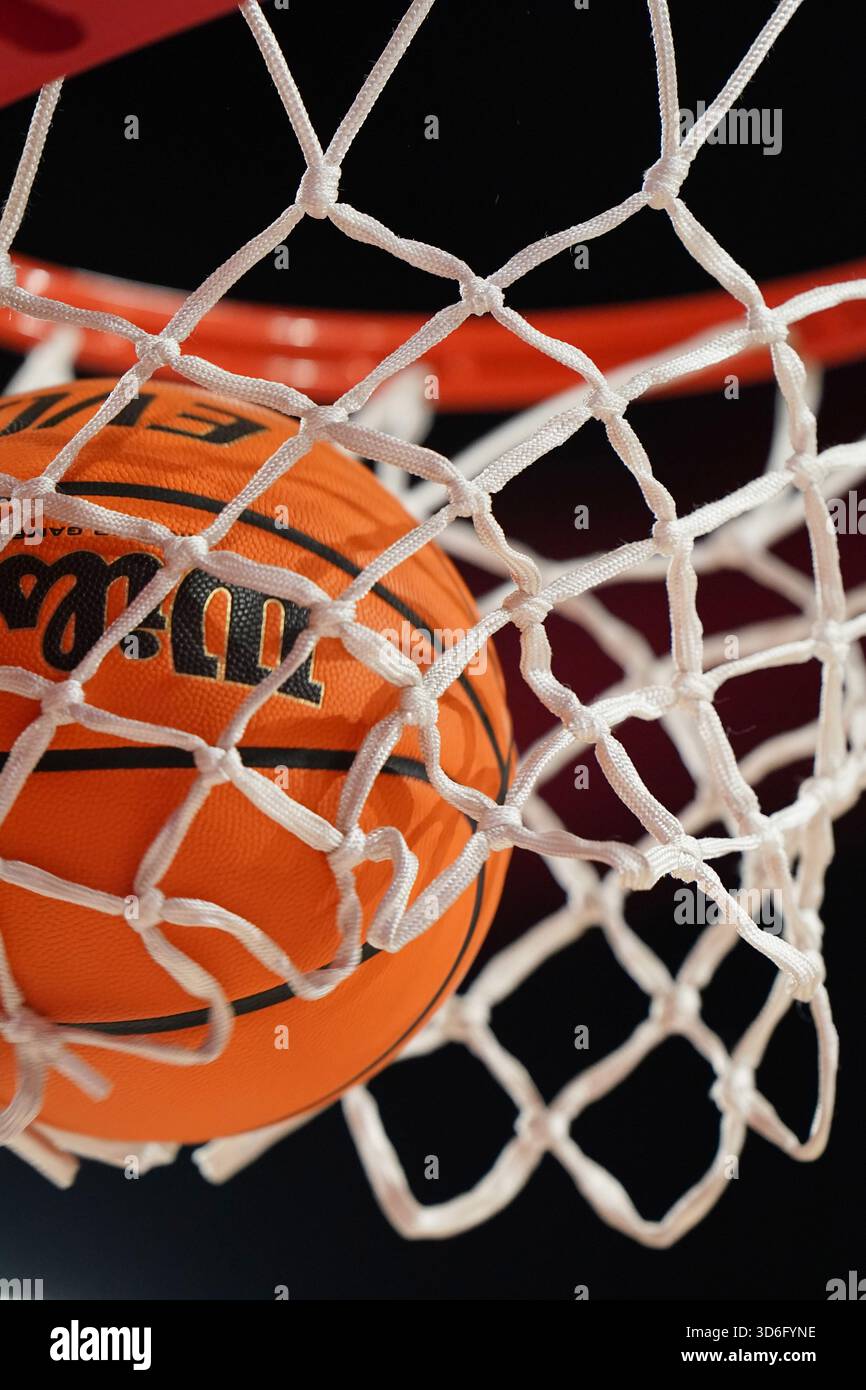 A basketball in the net during an NCAA basketball game between Oklahoma ...