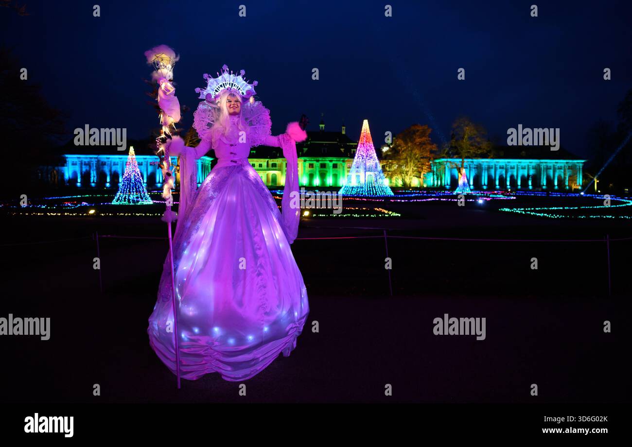 20 November 2025, Saxony, Dresden: Artist Lisa Rauch stands on stilts ...