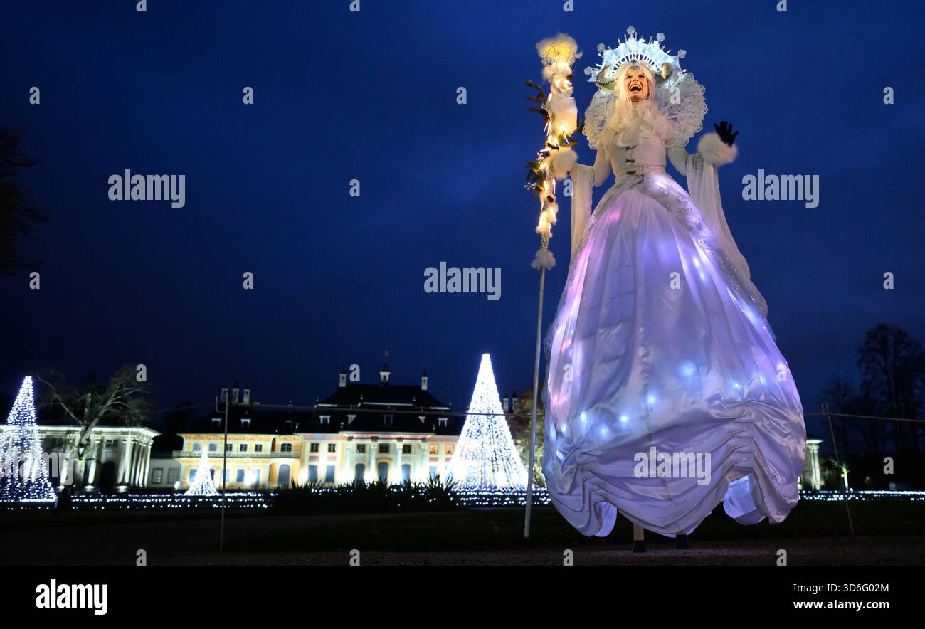 20 November 2025, Saxony, Dresden: Artist Lisa Rauch stands on stilts ...