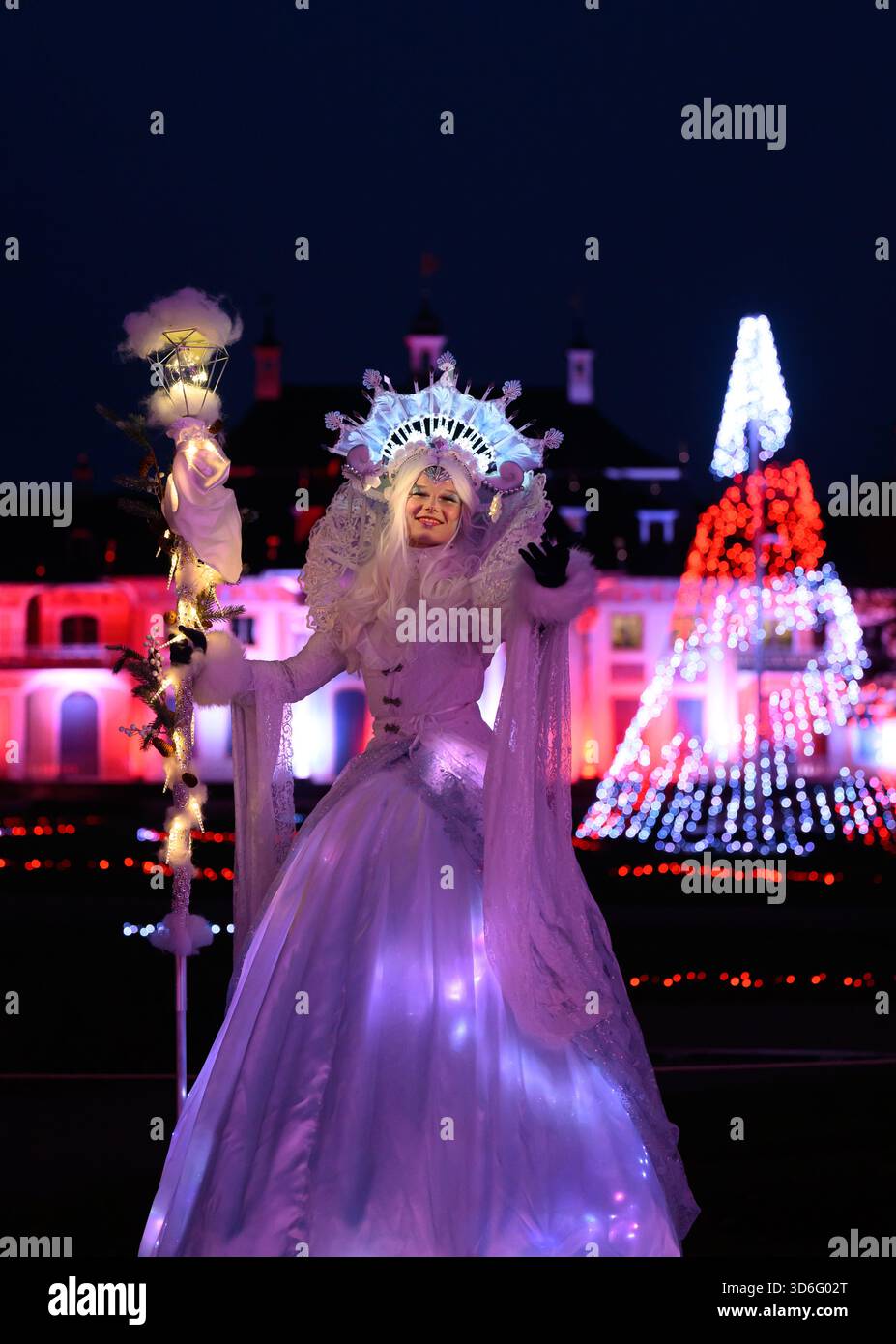 20 November 2025, Saxony, Dresden: Artist Lisa Rauch stands on stilts ...