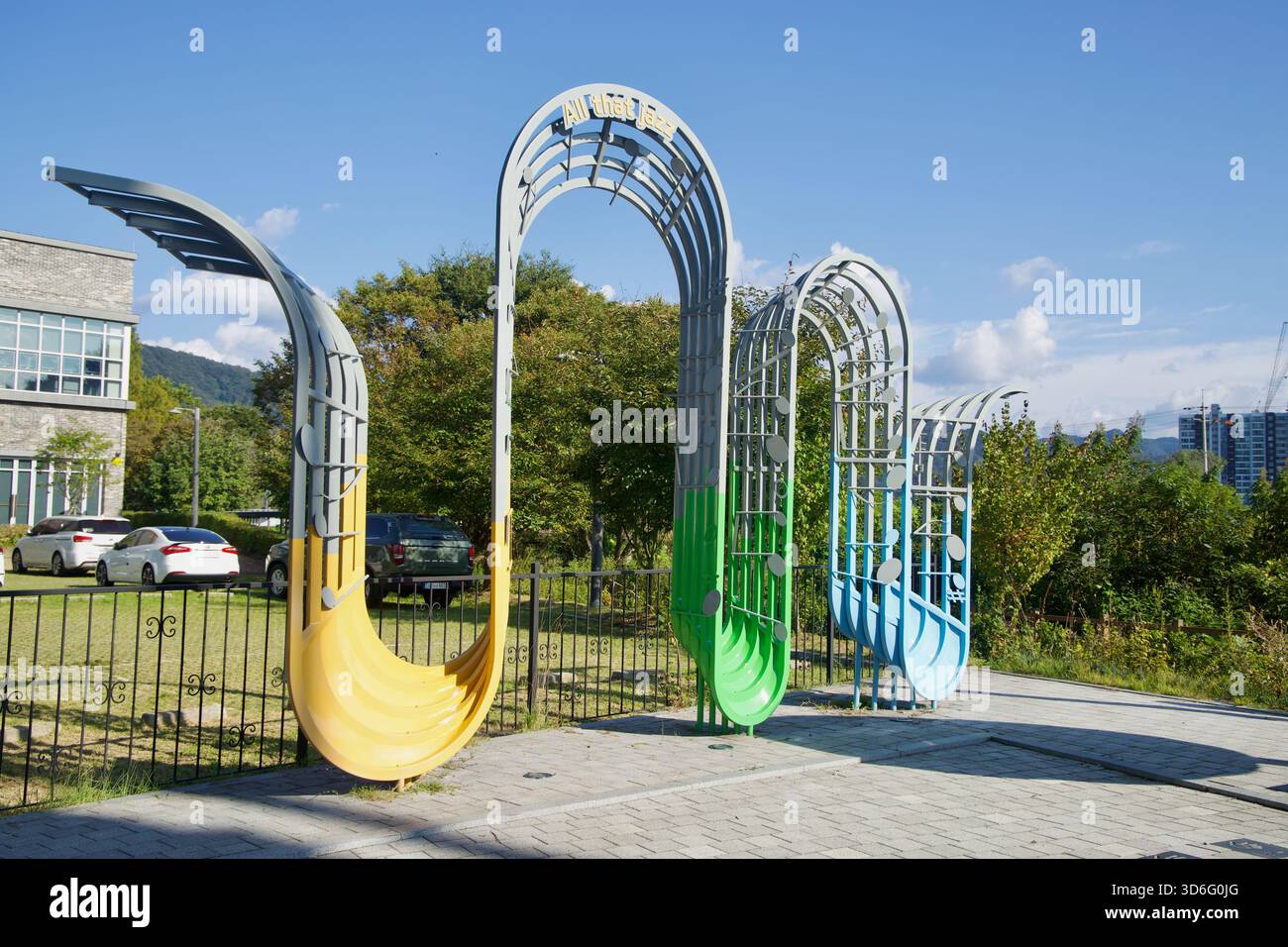Colorful arch sculptures shaped like musical notes form an ‘All that ...