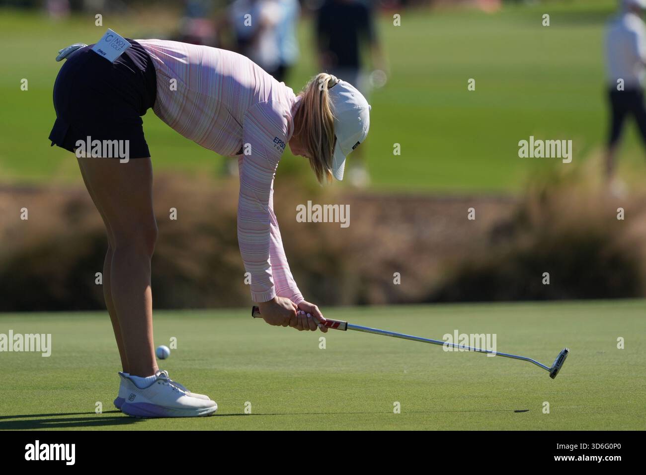 Brooke Matthews reacts to a missed putt on the 18th green during the ...