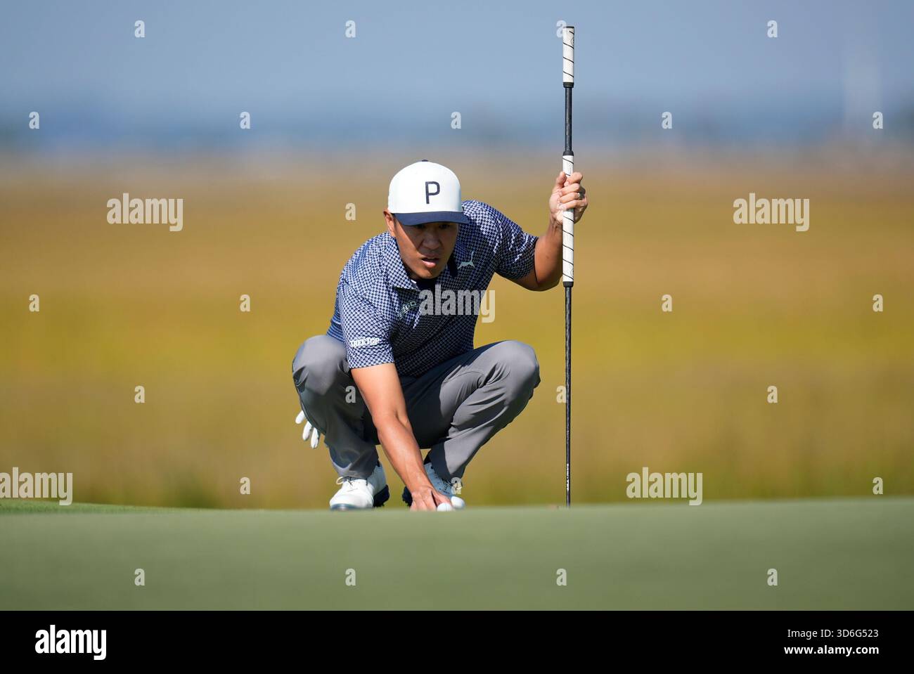 James Hahn lines up his putt on the 14th green during the first round ...
