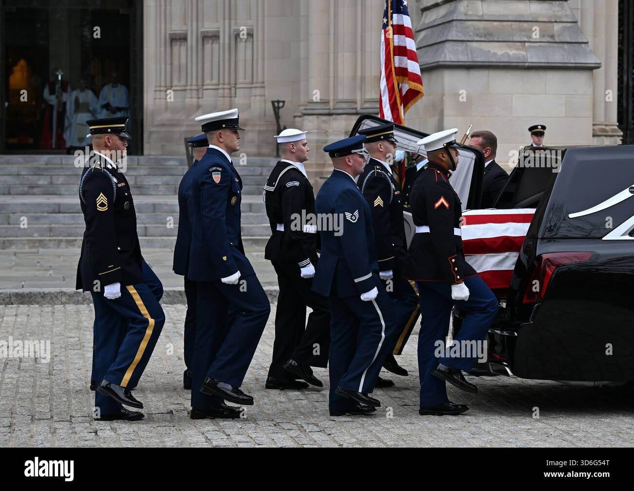 A military guard prepares to carry the casket of former Vice President ...