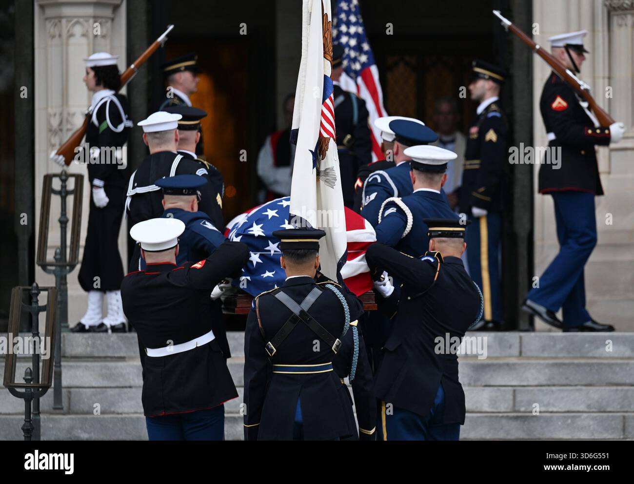 A military guard carries the casket of former Vice President Dick ...