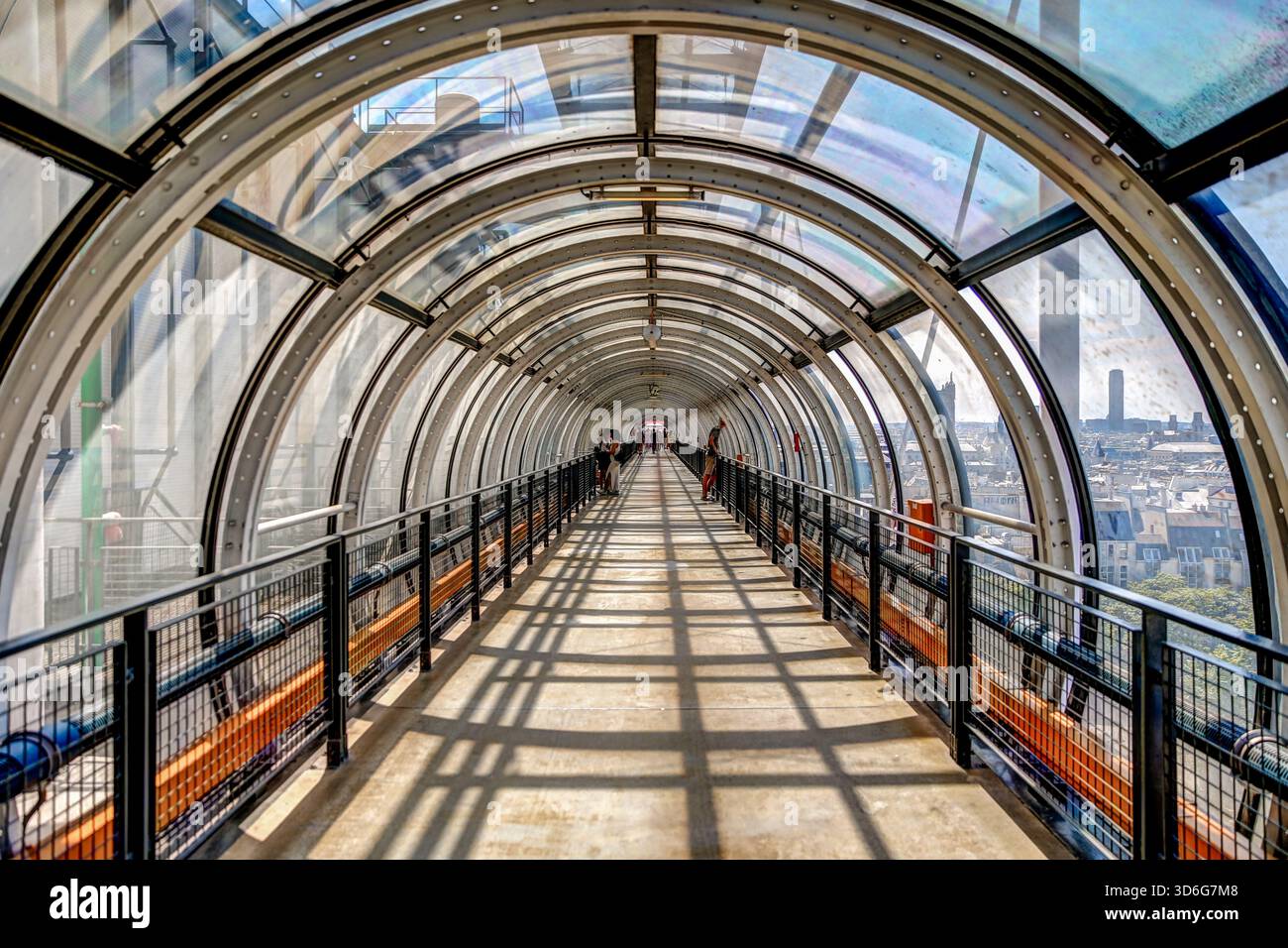 Glass-enclosed tubular walkway at the Centre Pompidou in Paris, France ...