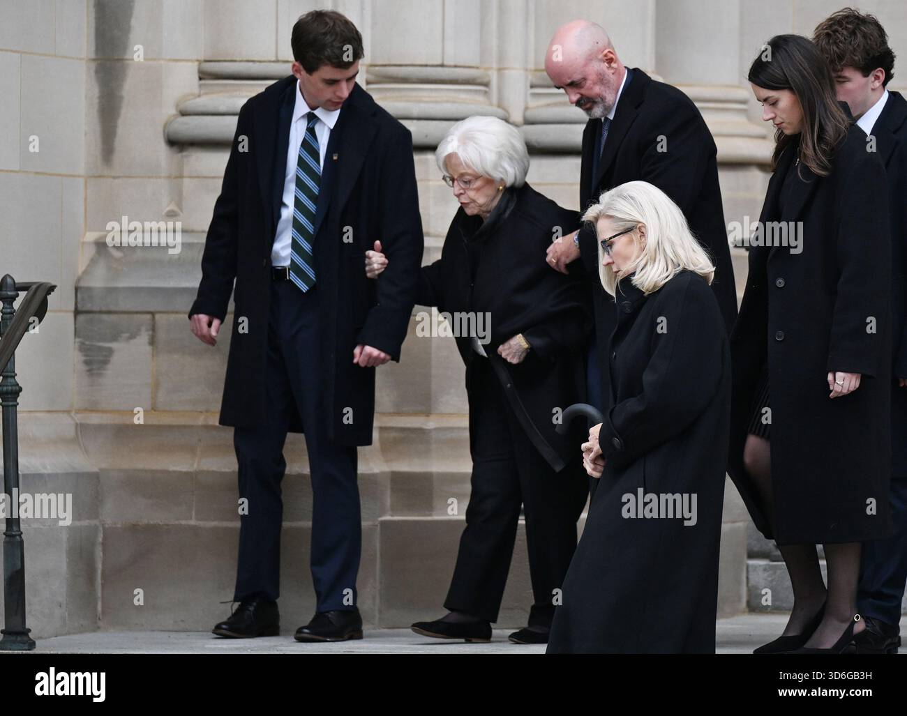 Lynne Cheney, widow of former Vice President Dick Cheney, is assisted ...
