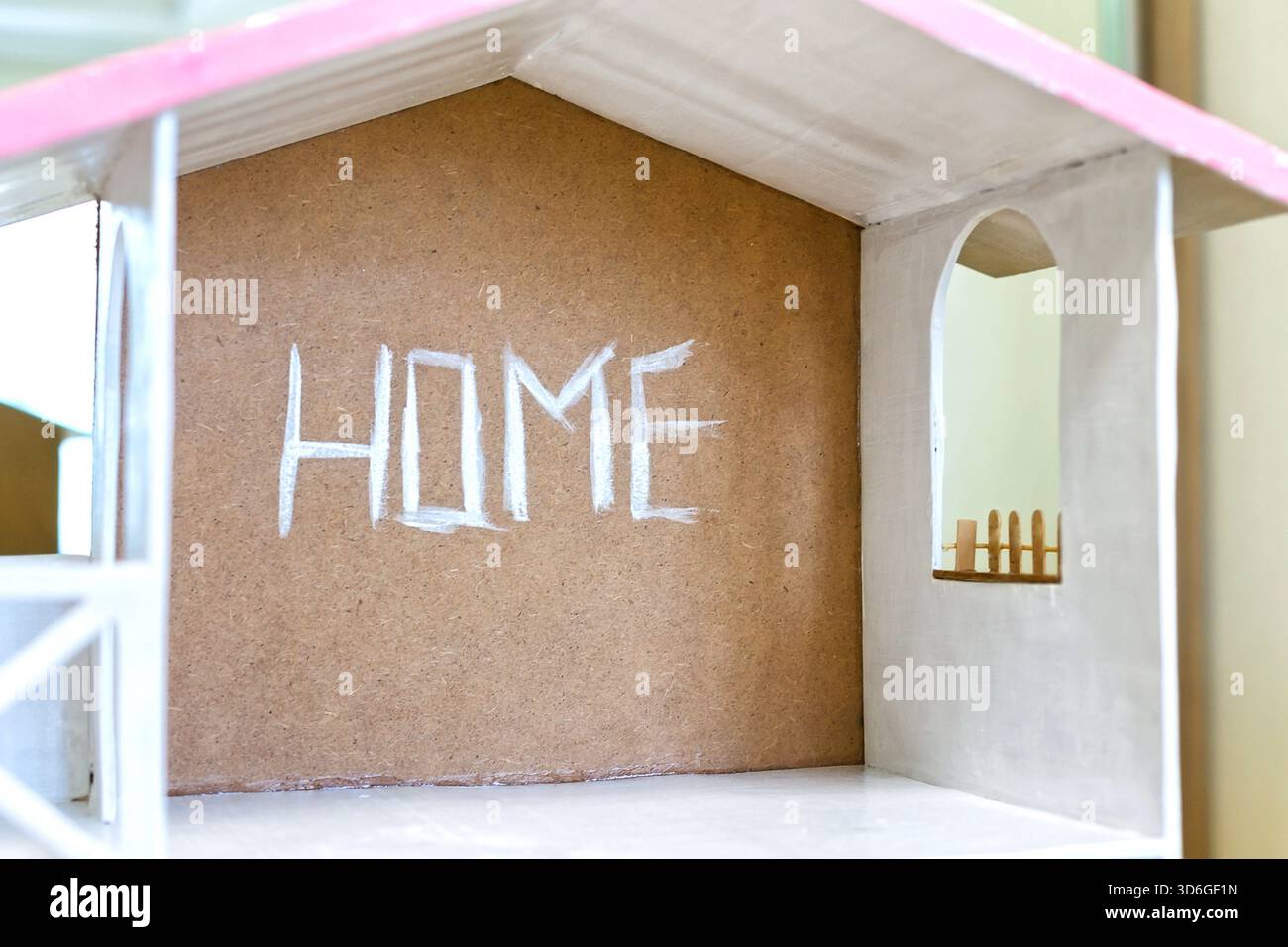 the inscription House on a brown wall with white paint Stock Photo - Alamy