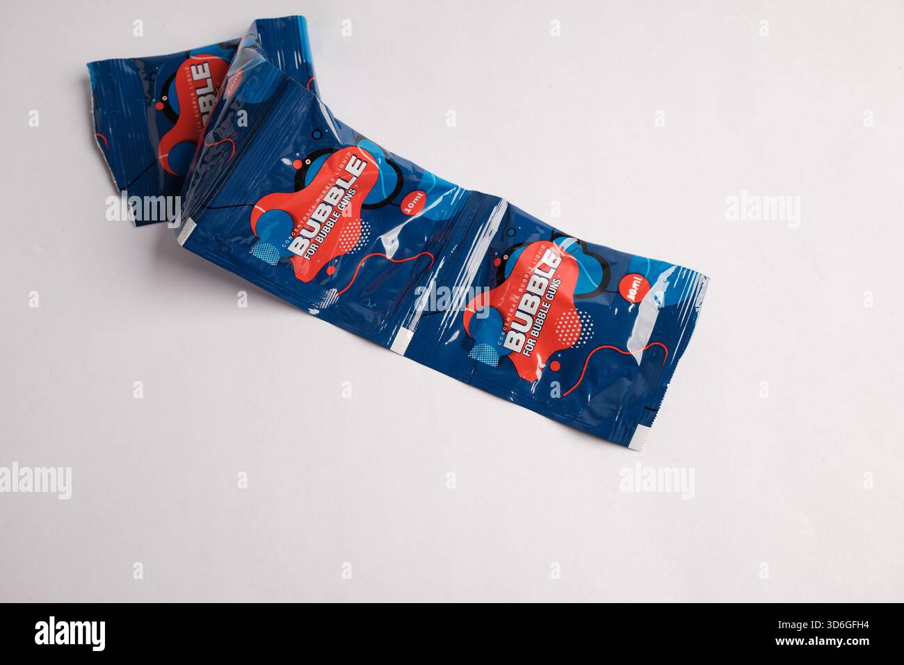 Blue and red bubble gum packaging on white background Stock Photo - Alamy