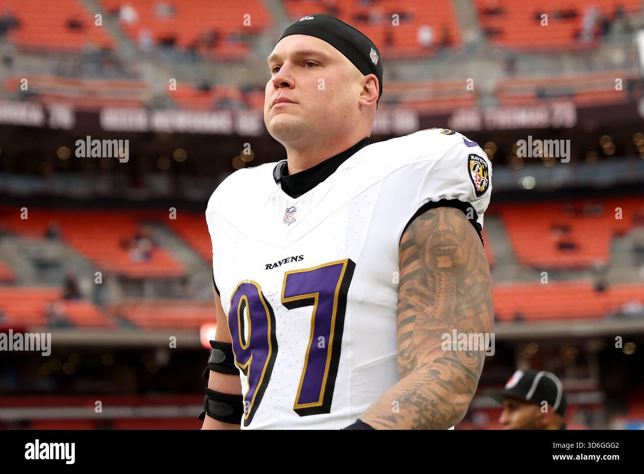 Baltimore Ravens defensive end Brent Urban (97) walks back to the ...