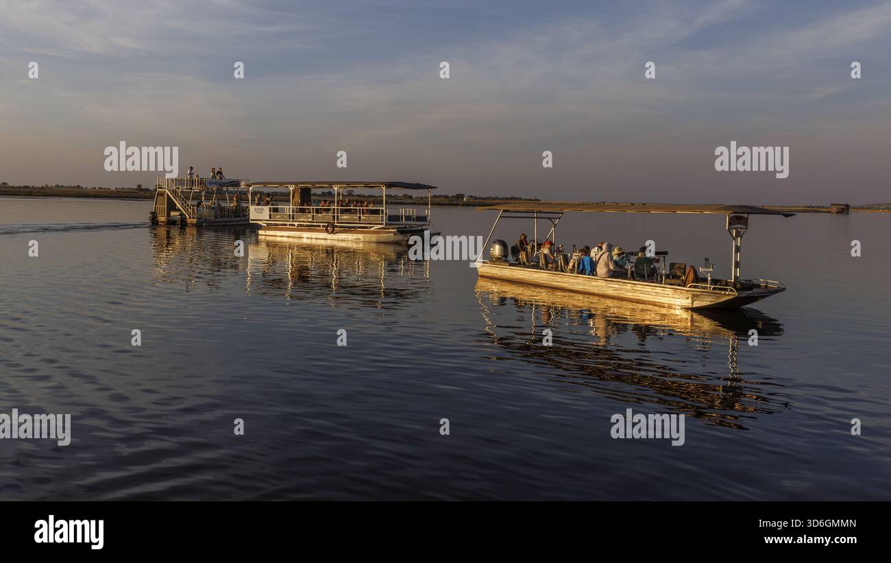 View of boats glide on the serene waters, reflecting the soft light of ...