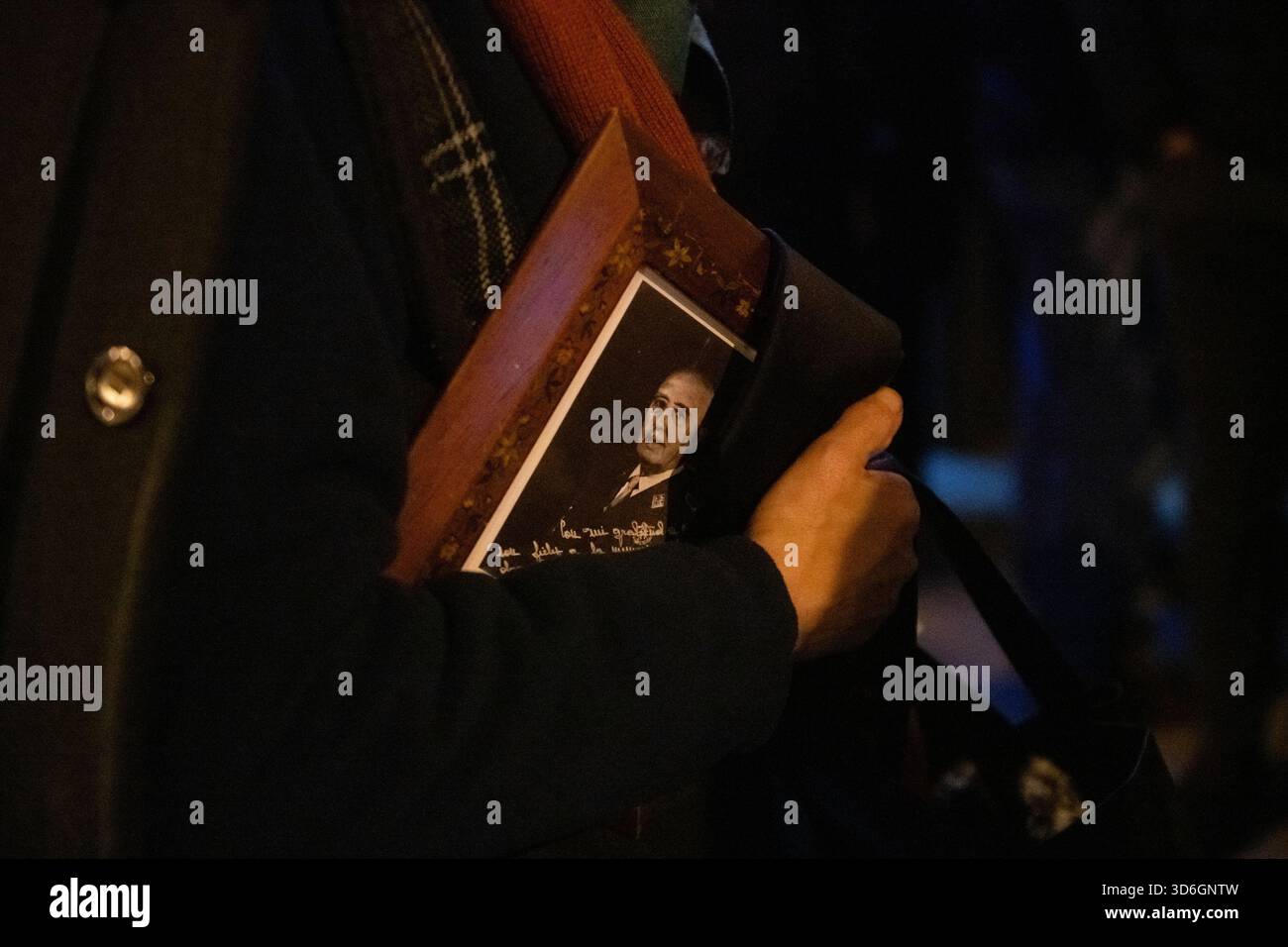 A person carries a portrait of Francisco Franco, at the exit of the ...
