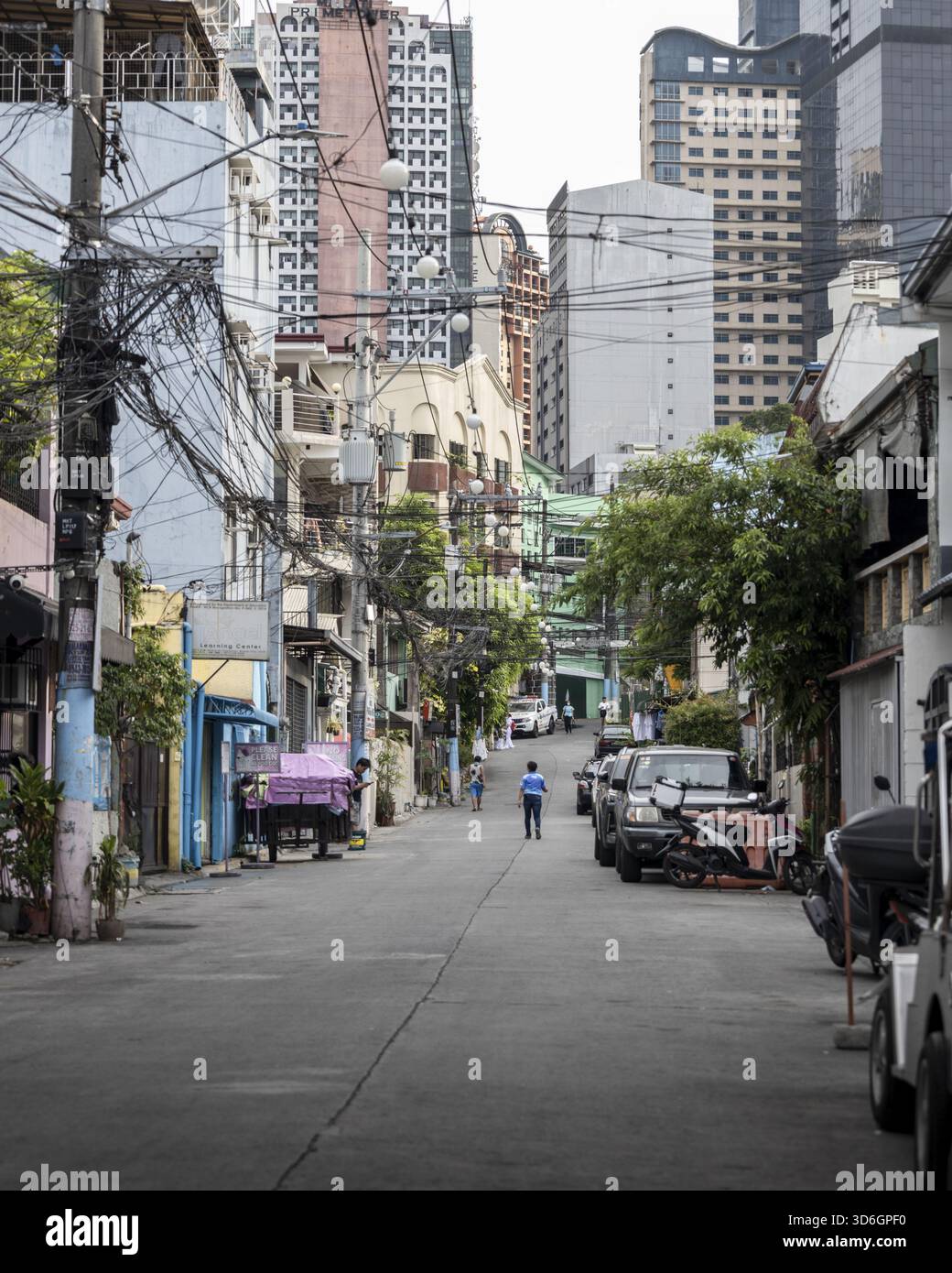 Manila, Philippines - 15 May 2023: View of a quiet street where old ...