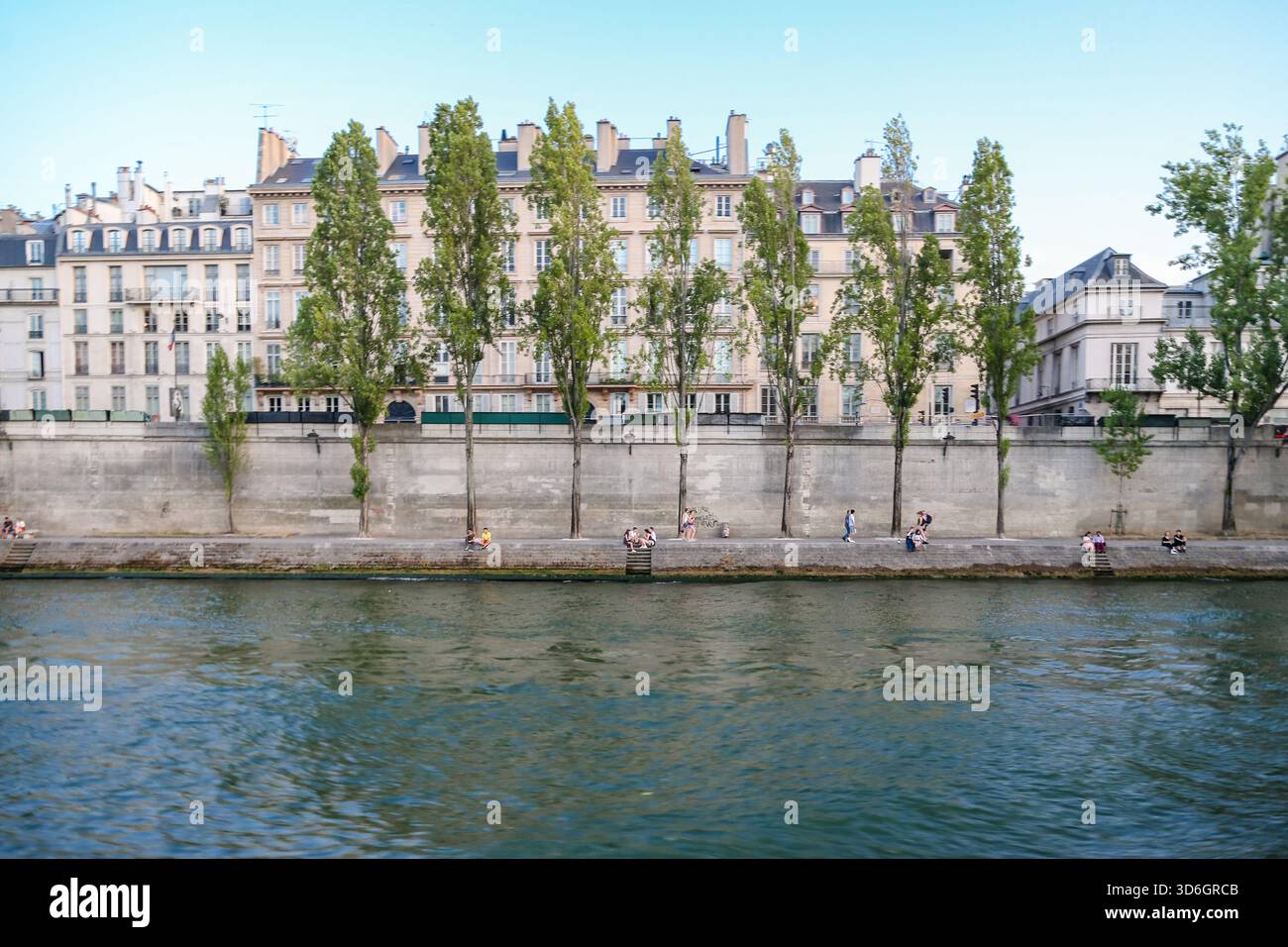 Pedestrians walk along the river seine in paris hi-res stock ...
