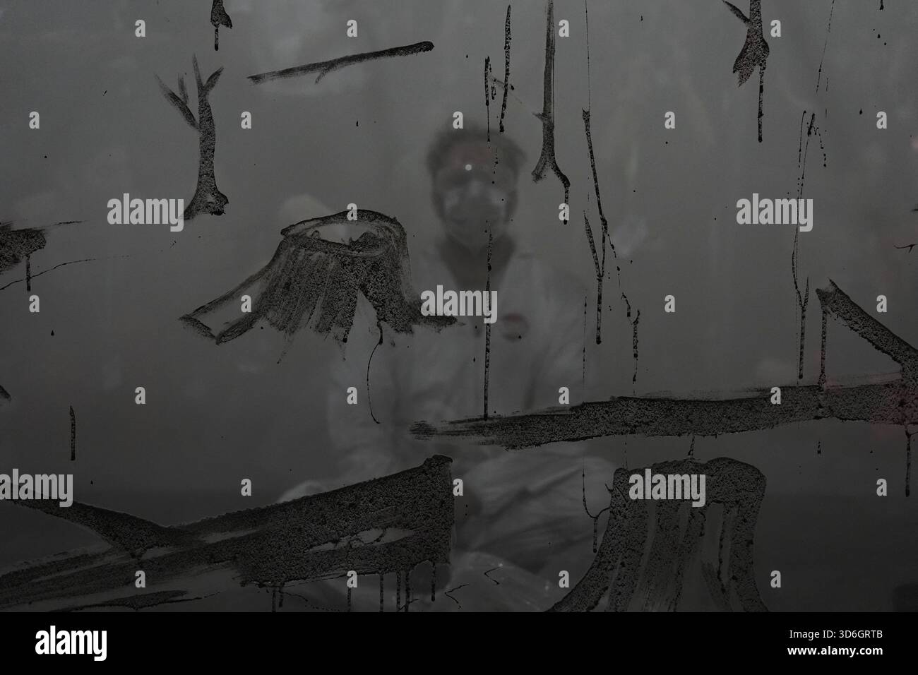 FILE - Brazilian artist MUNDANO sits inside his installation in which ...