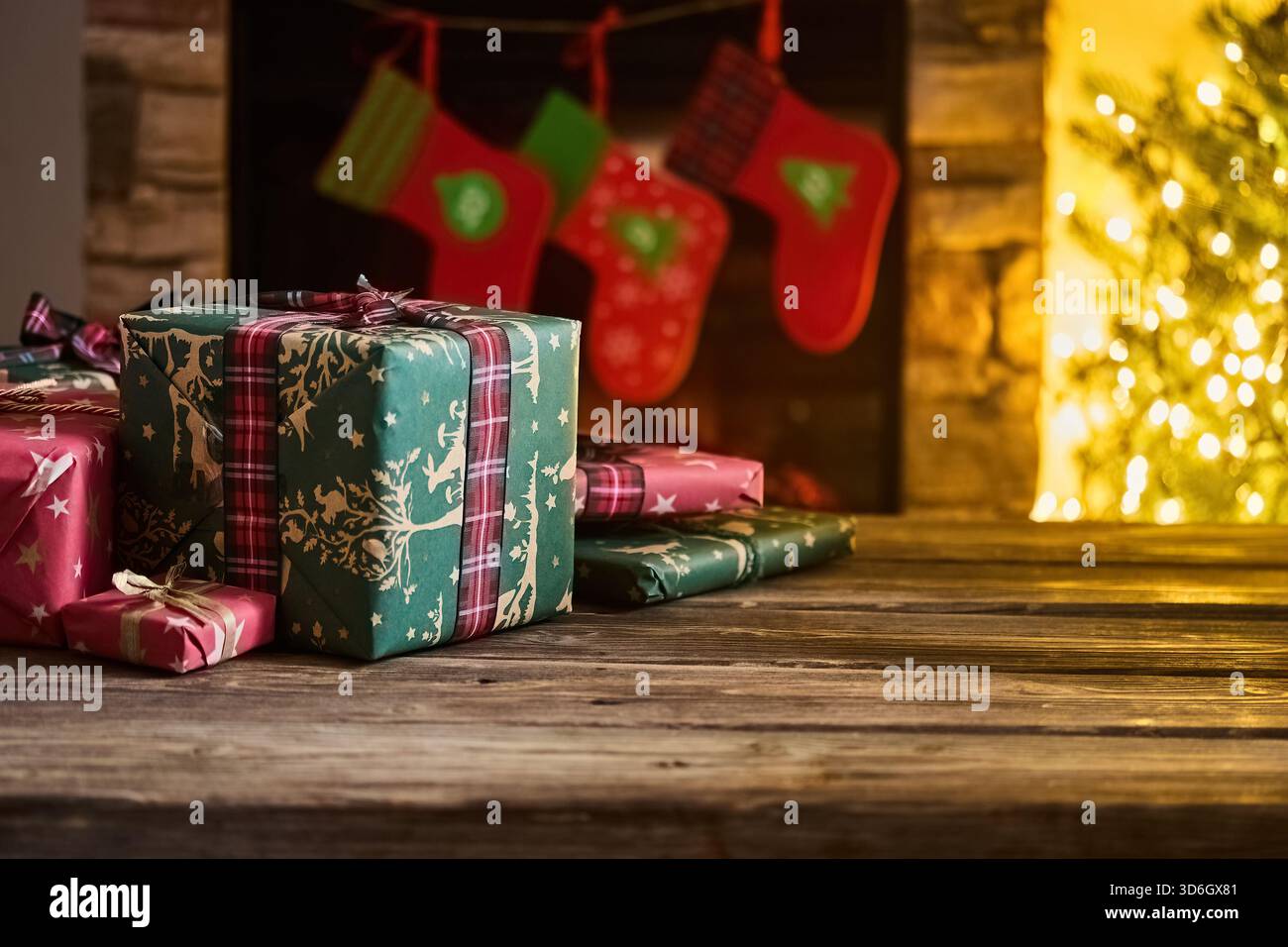 Cozy Christmas Scene. Festive presents and stockings by a warm ...